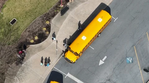 Students enter school bus at American sc... | Stock Video | Pond5