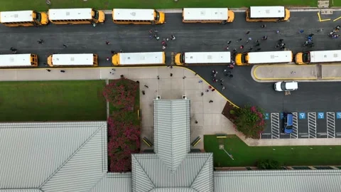 Students exit school building to bus. To... | Stock Video | Pond5