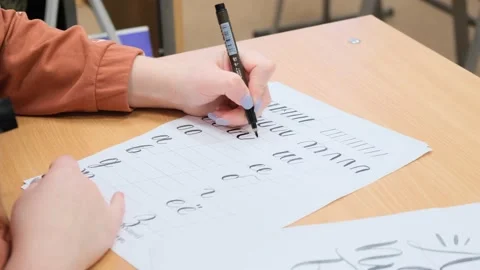 Students learning the art of calligraphy... | Stock Video | Pond5