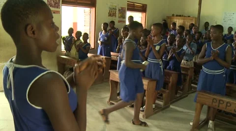 STUDENTS SINGING AND CLAPPING IN A CLASS... | Stock Video | Pond5