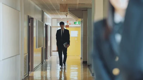 Students talking in school corridors | Stock Video | Pond5