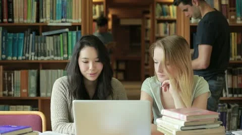 Students watching something on laptop in... | Stock Video | Pond5