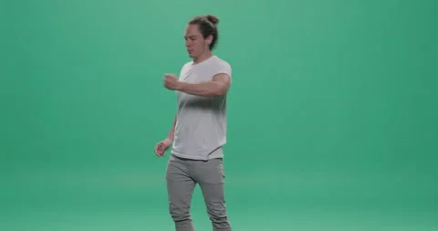 Studio, green screen, young man shows of... | Stock Video | Pond5