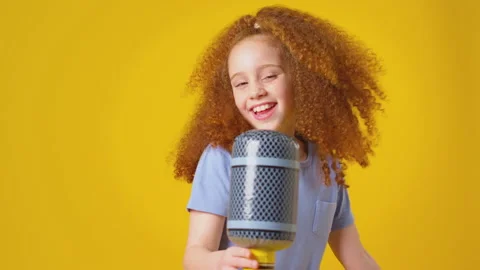 Studio Shot Of Girl Singing Karaoke Into... | Stock Video | Pond5
