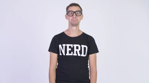 Studio shot of sad nerd man giving thumb... | Stock Video | Pond5