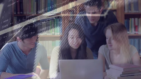 Study group flipping textbook and typing... | Stock Video | Pond5