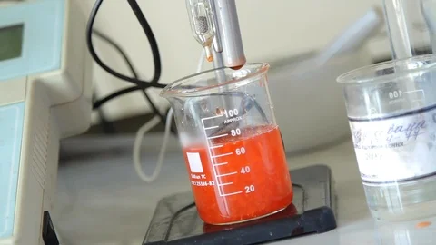 The study of red fluid in laboratory equ... | Stock Video | Pond5