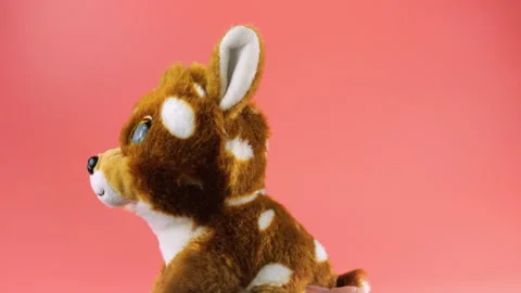 Stuffed and fluffy plush toy fawn turns ... | Stock Video | Pond5
