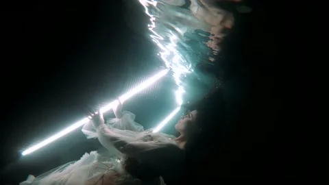 stunning beauty lady is floating in dark... | Stock Video | Pond5