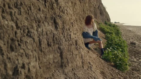 Stylish girl sitting beach lean on sand ... | Stock Video | Pond5