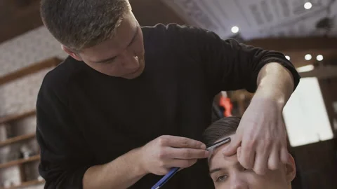 Stylist makes contour to haircut with bl... | Stock Video | Pond5