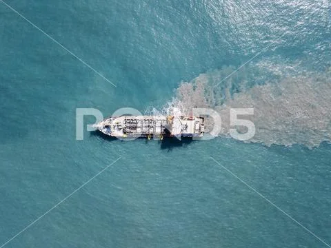 Suction Dredger ship working near the port - with mud, Pollution Stock ...