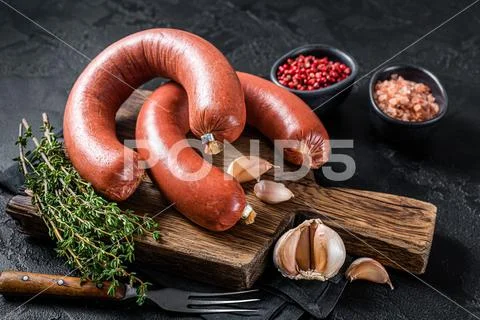 Sucuk meat sausage, Sujuk dry spicy sausage. Black background. Top view ...