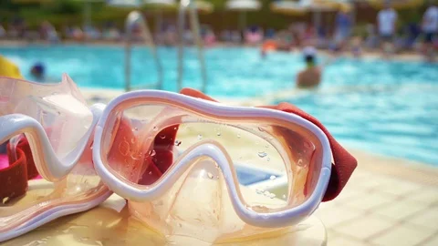 Summer, diving mask, pool background | Stock Video | Pond5
