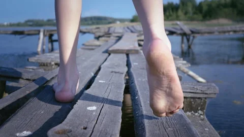 Summer Stroll: Barefoot Boy on a Wooden ... | Stock Video | Pond5