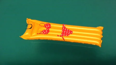 Sun bed floating in a pool | Stock Video | Pond5