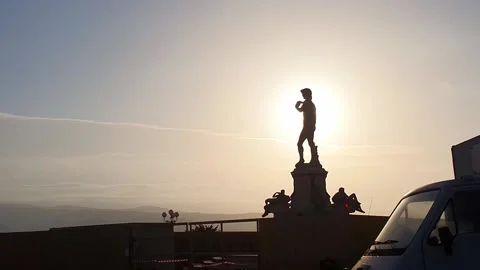 Sun behind the statue of Michelangelo, i... | Stock Video | Pond5