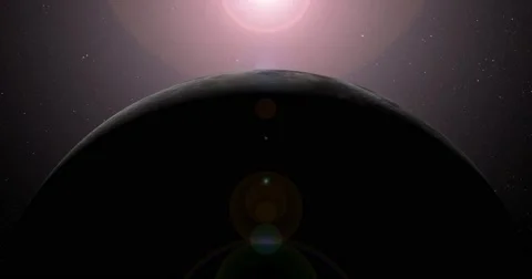 The sun bursts into view over the Moon's... | Stock Video | Pond5