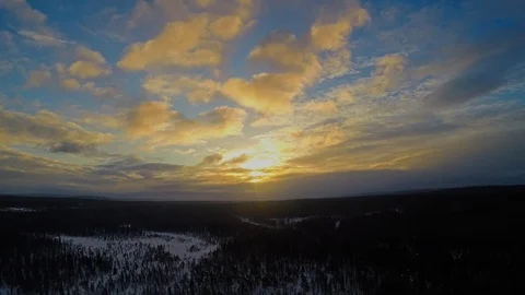 Sun in the clouds above the tundra | Stock Video | Pond5