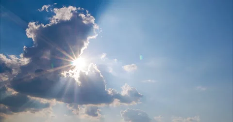 the sun comes out from behind a cloud of... | Stock Video | Pond5