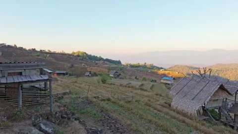 Sun-kissed valley fields and rustic roof... | Stock Video | Pond5