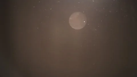 Sun rays shining on the dust particles a... | Stock Video | Pond5