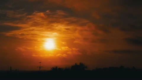 Sun Rising over Slow Moving Clouds in Or... | Stock Video | Pond5