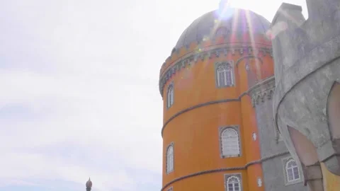 The sun shining over the yellow tower at... | Stock Video | Pond5