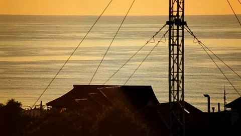 Sunset Back Lit Ocean Shore Cottage Vill... | Stock Video | Pond5