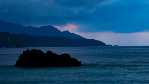 Sunset of beach side at Amamiooshima tim... | Stock Video | Pond5