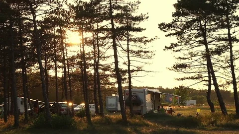 Sunset at campsite, modern caravan campe... | Stock Video | Pond5