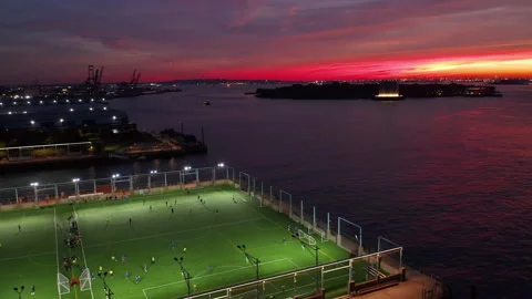 sunset flying clockwise around soccer fi... | Stock Video | Pond5