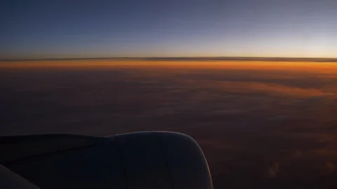 sunset sky airplane window seat view on ... | Stock Video | Pond5