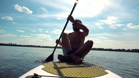 Sup Surfing .Stand Up Paddling Surfboard... | Stock Video | Pond5