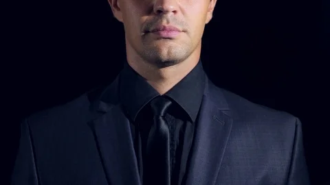 super close-up of a man in black clothes... | Stock Video | Pond5