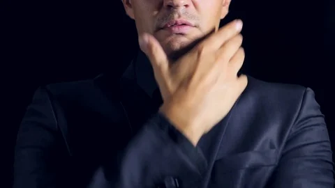 super close-up of a man in black clothes... | Stock Video | Pond5