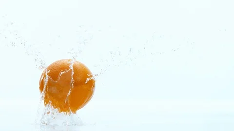 Super slow motion of falling orange, iso... | Stock Video | Pond5