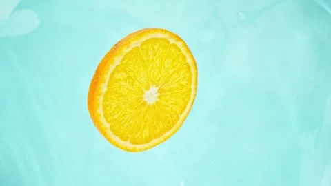 Super Slow Motion of Falling Orange Slic... | Stock Video | Pond5