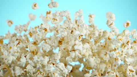 Super slow motion of falling popcorn on ... | Stock Video | Pond5