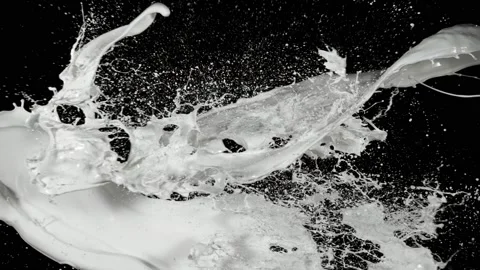 Super slow motion of flying milk splashe... | Stock Video | Pond5