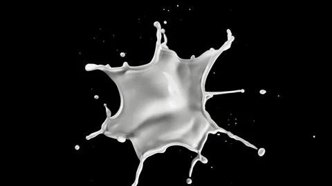 Super slow motion of flying milk splash ... | Stock Video | Pond5