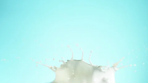 Super slow motion of milk splash isolate... | Stock Video | Pond5