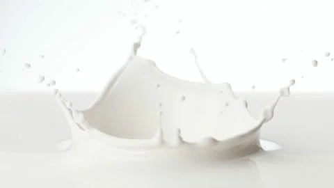 Super slow motion of milk splash isolate... | Stock Video | Pond5