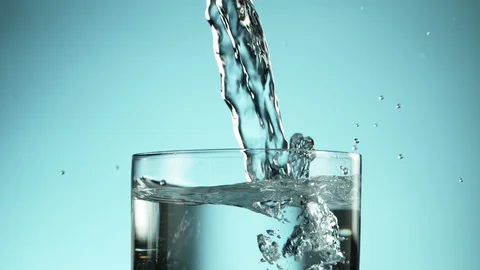 Super slow motion of pouring water into ... | Stock Video | Pond5