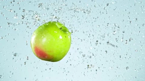 Super Slow Motion Shot of Apple with Spl... | Stock Video | Pond5