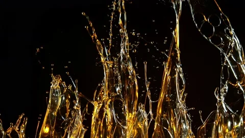 Super Slow Motion Shot of Splashing Gold... | Stock Video | Pond5