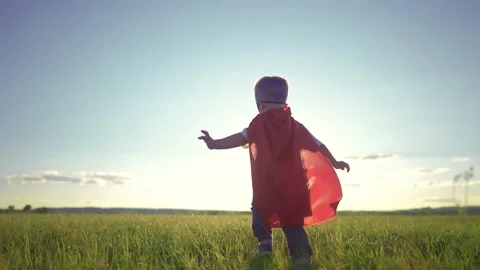 superhero. little boy running across the... | Stock Video | Pond5