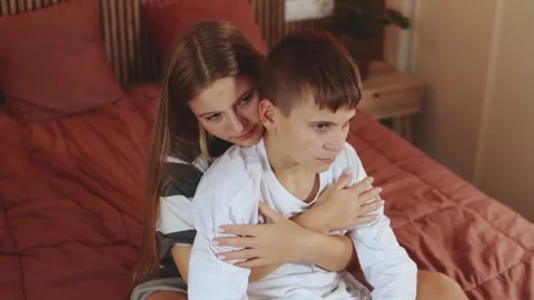 Supportive sister comforting crying sibl... | Stock Video | Pond5