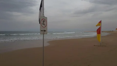 Surf life saving flags at beach | Stock Video | Pond5