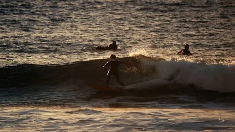 Surf scene active people in the ocean | Stock Video | Pond5